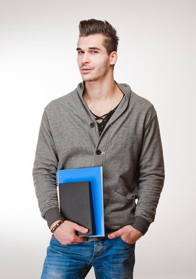 Handsome young student. stock photo. Image of jeans, smiling - 34724906