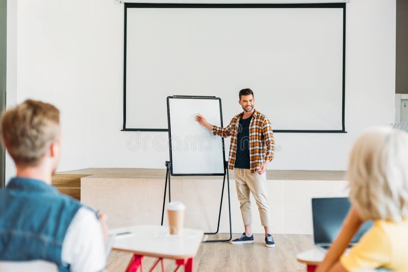 Handsome Young Teacher Making Presentation for Group of Students Stock ...