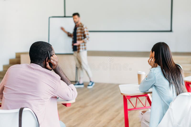 Handsome Young Teacher Making Presentation for Group of Students Stock ...