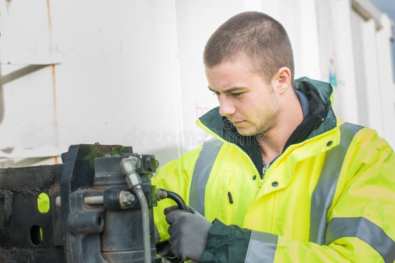 Handsome Young Worker Fixing Something Stock Photo - Image of ...