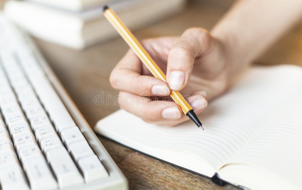 Handwriting, Female Hand Writes with a Pen in a Diary Notebook ...