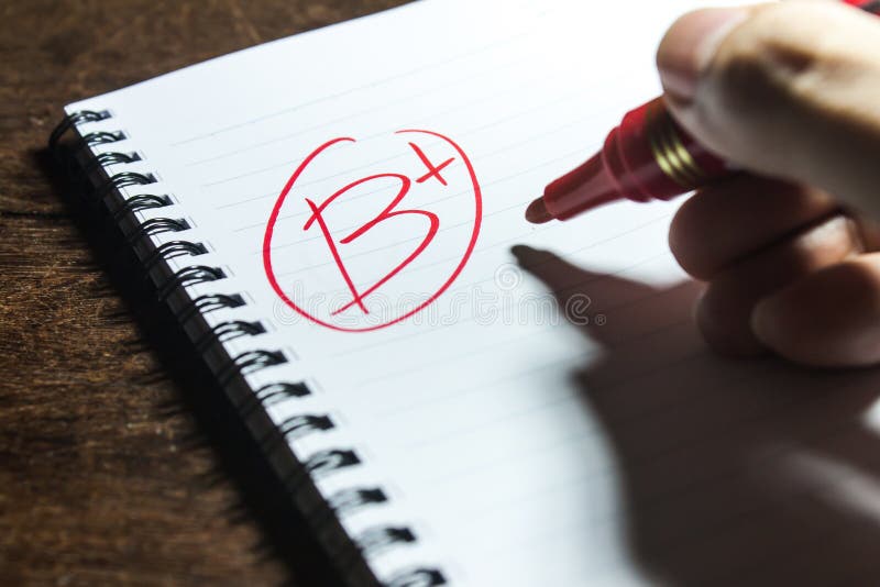 Handwriting Grade B Plus on Notebook Stock Image - Image of performance ...