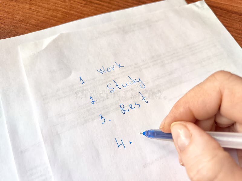 Handwriting a Personal To-Do List on Paper. Close-up of a Handwriting a ...