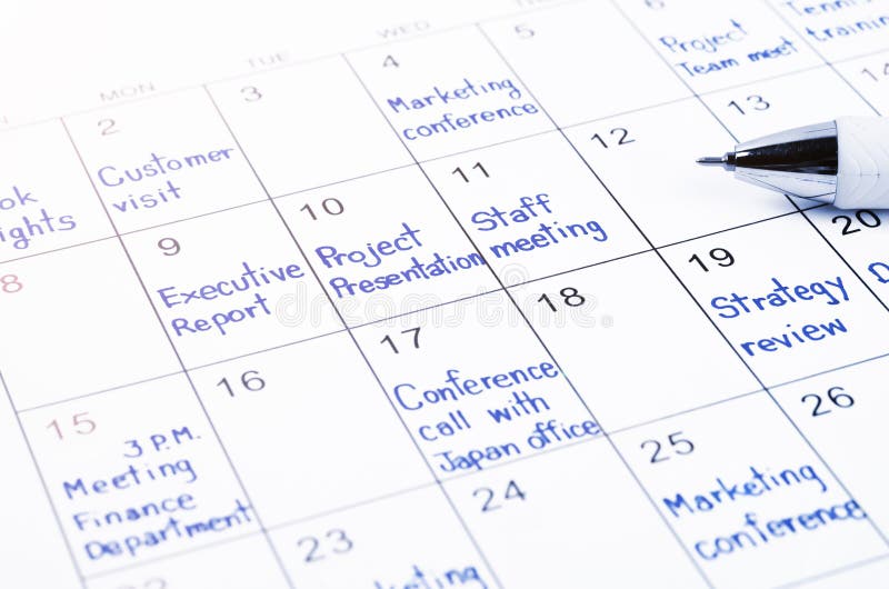 The Handwriting Scheduling Appointments on Calendar Sheet with Pen ...
