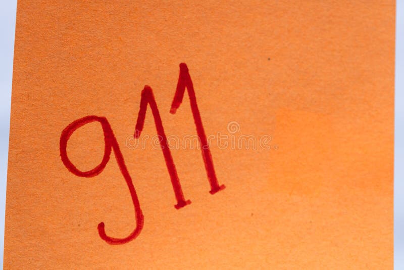 911 Handwriting Text Close Up Isolated on Orange Paper with Copy Space ...