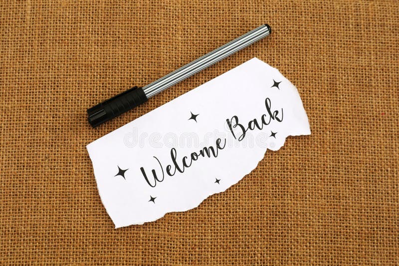 Handwritten Calligraphy on Torn Note Paper with the Text Welcome Back ...
