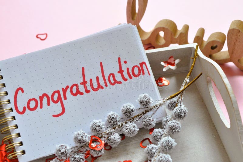 Handwritten Congratulation Card Next To Branches on a Tray Stock ...
