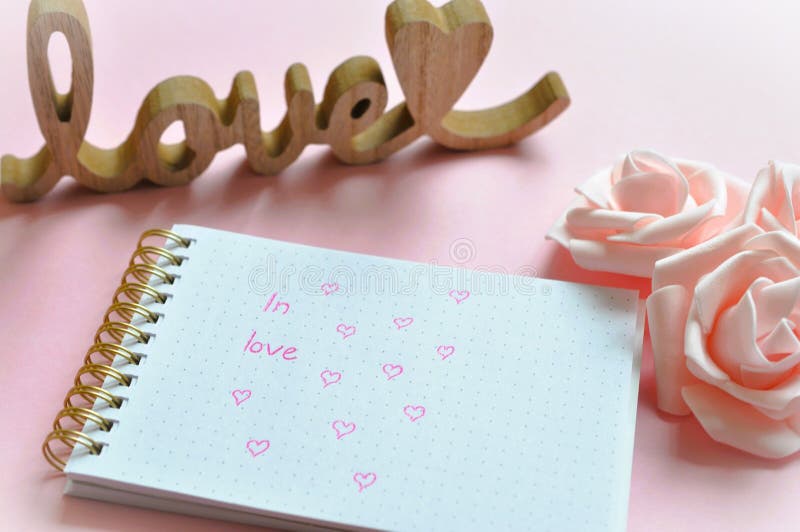 Handwritten in Love Text in Notepad on Pink Background Stock Image ...