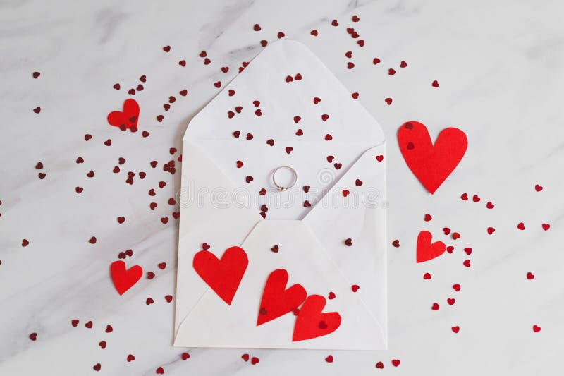 Heartfelt Proposal on a Handwritten Note with a Ring on a Red Paper ...