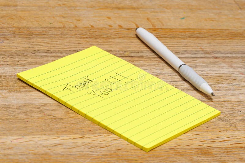 Handwritten Note Saying "Thank You" with Pen and Yellow Pad Stock Image ...