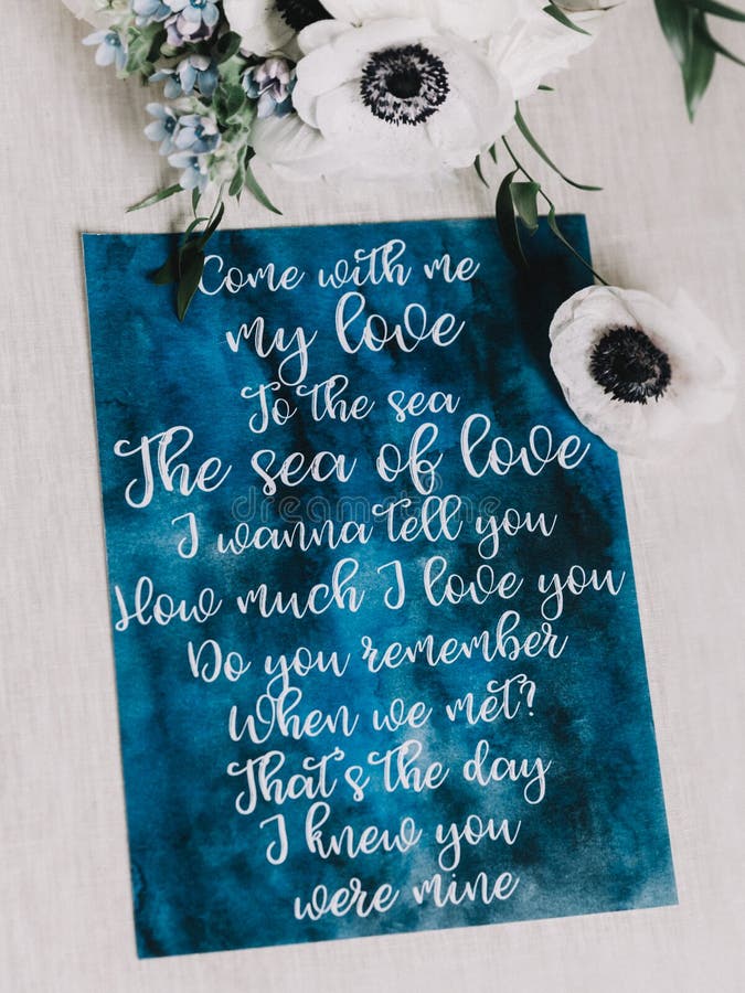 Romantic Handwritten Poem on Teal Background with Flowers Nearby ...