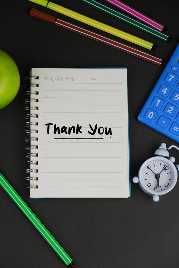 Handwritten of THANK YOU on Note Book with Black Background Stock Photo ...