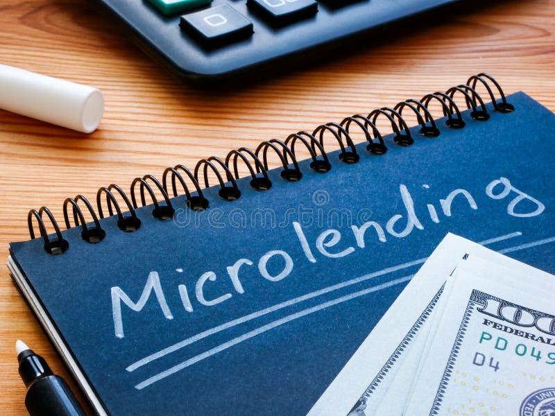 Written Word Microlending in the Notepad and Cash. Stock Image - Image ...