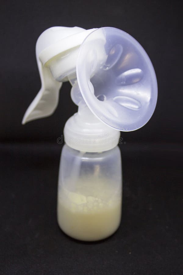 Breast pump with milk stock image. Image of lactation - 109930787