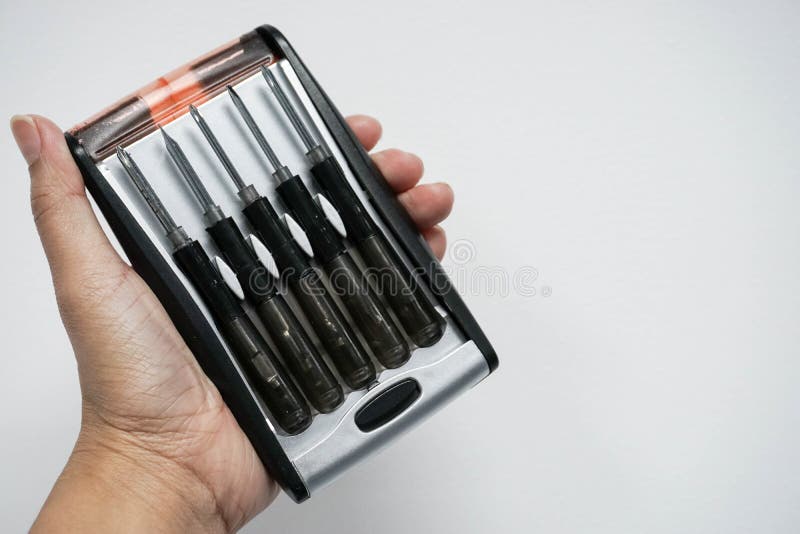 Handy screwdriver in hand stock image. Image of parts - 77700351