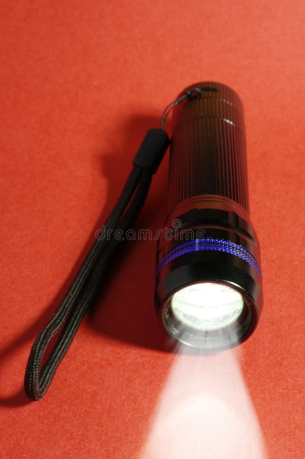 Handy LED torch in hand stock photo. Image of electrical - 25653538
