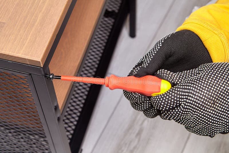 Handyman is Assembling Flat Pack TV Stand Using Screwdriver Stock Photo ...