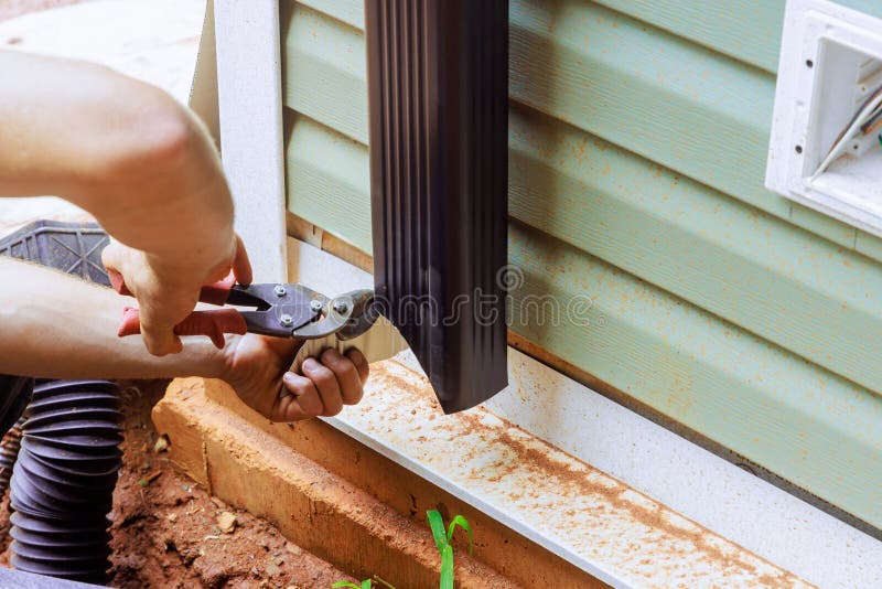 Handyman it is Assembling with Installation of a Gutter Channel are ...