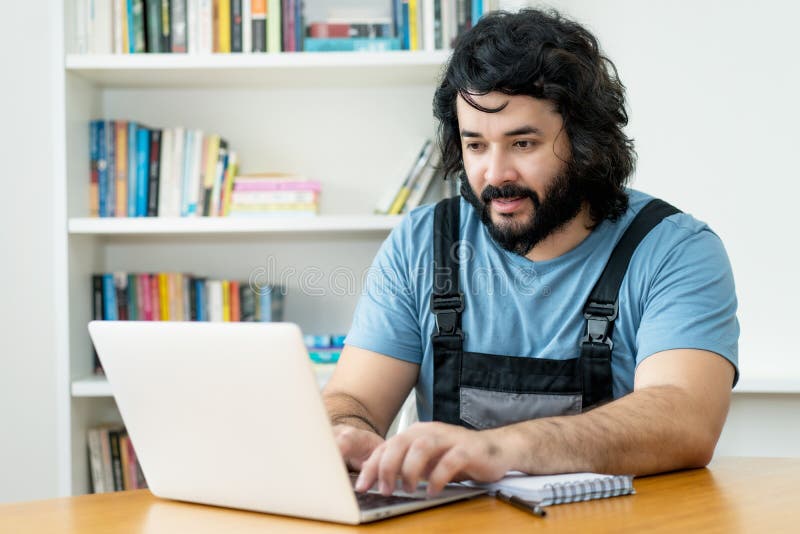 Handyman with Beard Ordering Material Online at Computer Stock Image ...
