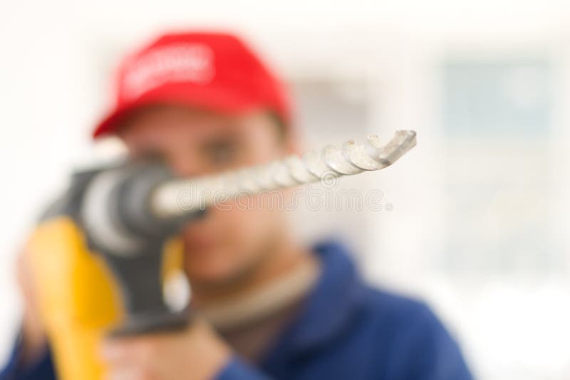 Handyman with big drill stock image. Image of craftsman - 12503177
