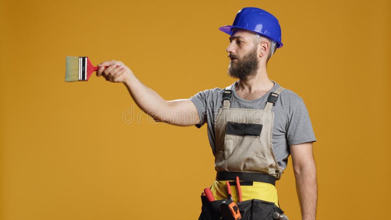 Handyman Builder Working with Paintbrush To Renovate Walls Stock Photo ...