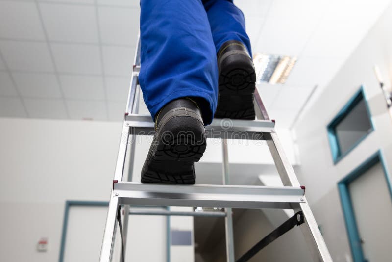 Handyman Climbing Ladder stock image. Image of metal - 214520145