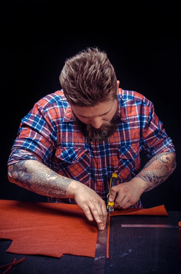 Tanner of Leather Processes a Workpiece from Leather Stock Image ...