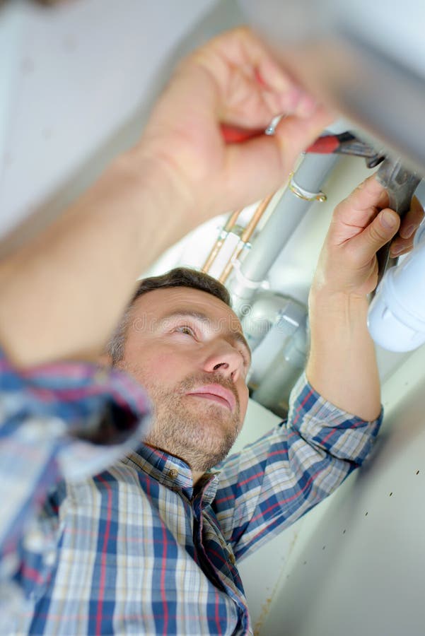 Handyman doing his job stock image. Image of tool, process - 116222435