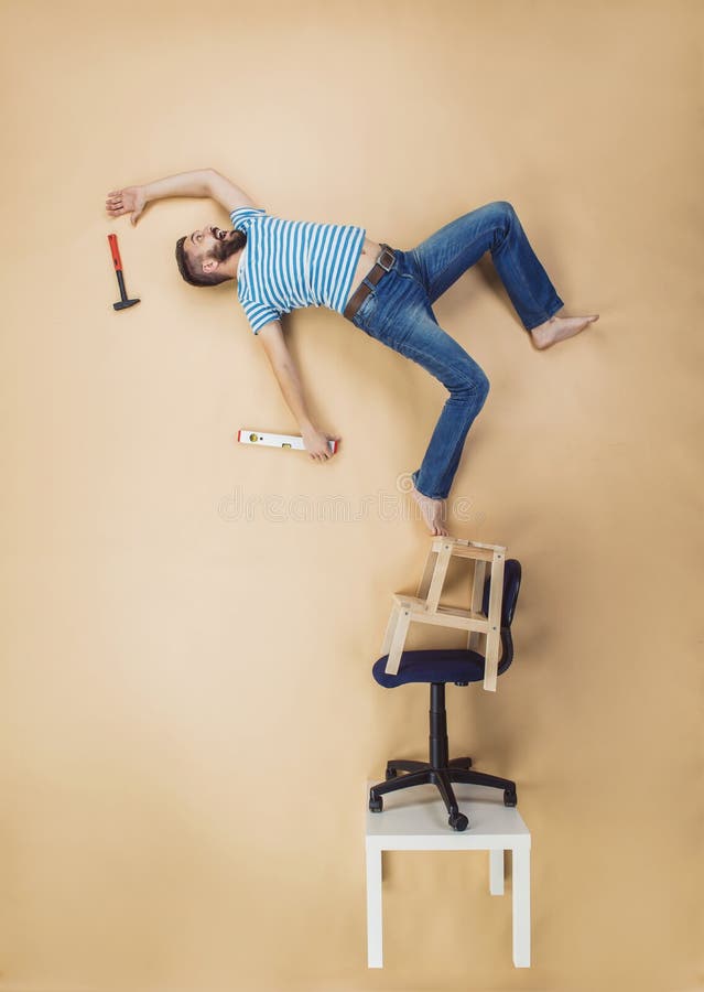 Handy Man Falling from Ladder in the Living Room Stock Image - Image of ...