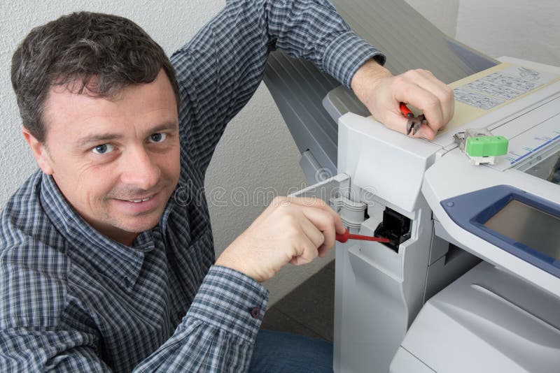 Handyman Fixing the Office Printer or Copy Machine Stock Image - Image ...