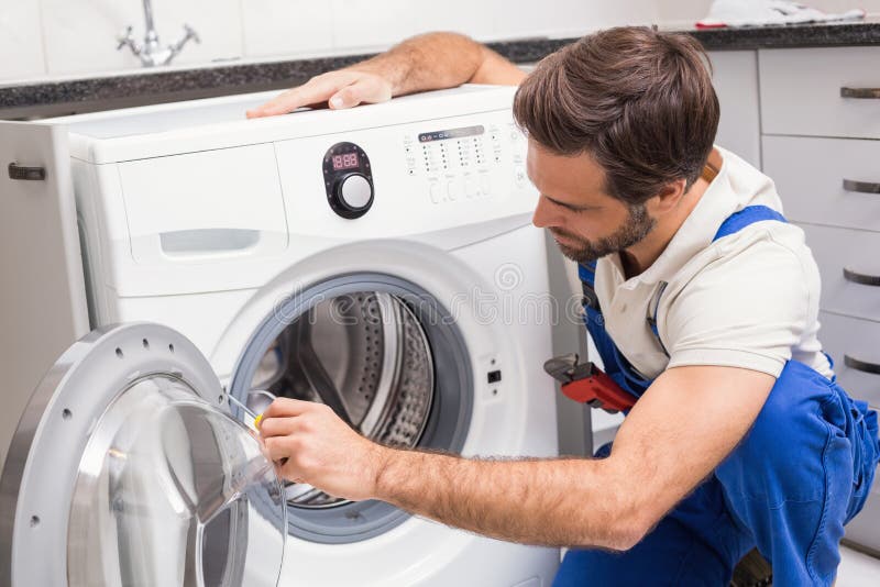 Handyman Fixing a Washing Machine Stock Photo - Image of repairman ...