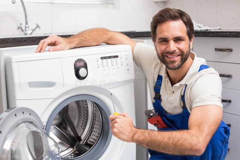 Handyman Fixing a Washing Machine Stock Image - Image of reparation ...