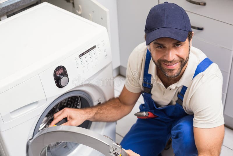 Handyman Fixing a Washing Machine Stock Image - Image of tool, worker ...