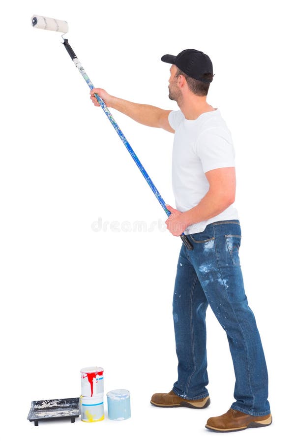Handyman is Painting Wall with Help of Paint Roller during Home Repair ...