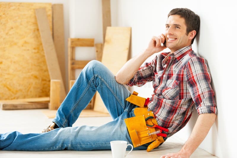 Handyman relaxing. stock image. Image of confidence, building - 41192611