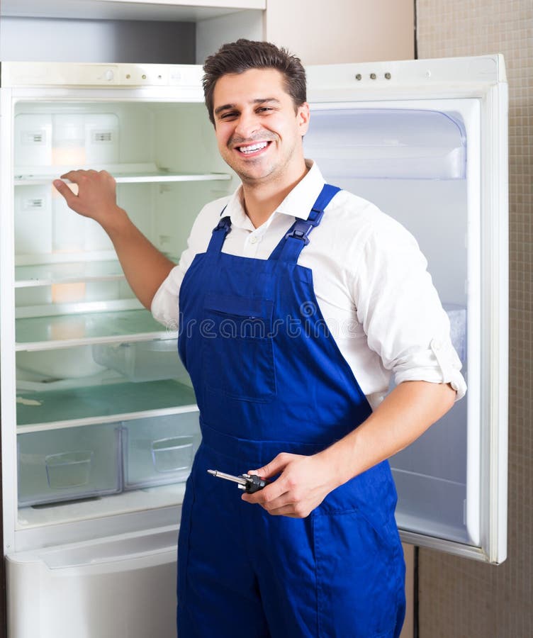 Handyman Repairing Refrigerator in Kitchen Stock Image - Image of ...