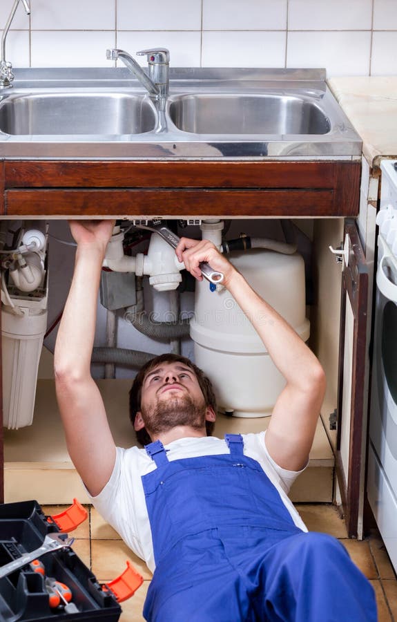Handyman repairs sink stock photo. Image of service, mechanic - 50198220