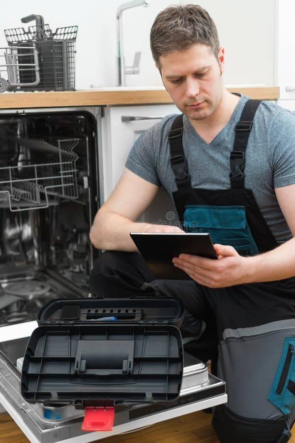 Handyman with tablet pc stock photo. Image of problem - 137201120