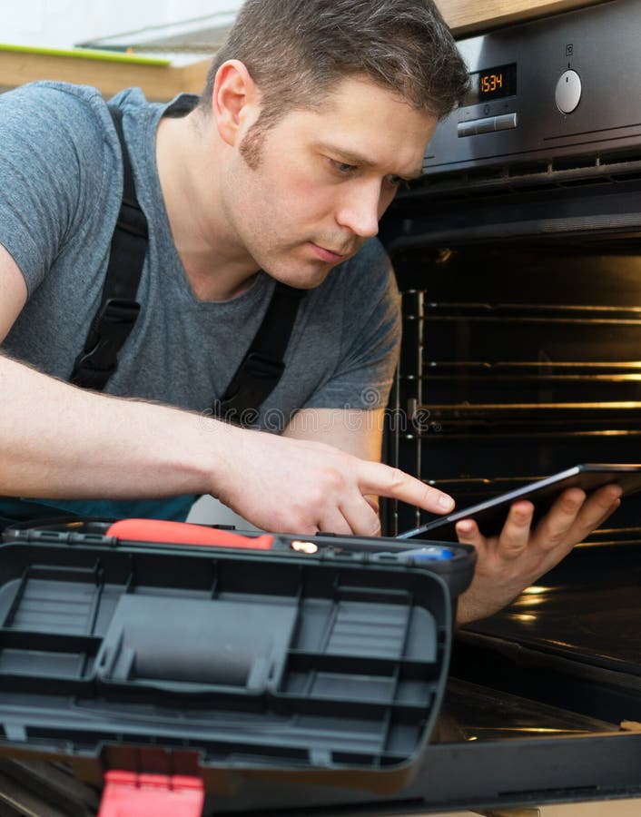 Handyman with tablet pc stock photo. Image of problem - 137201120