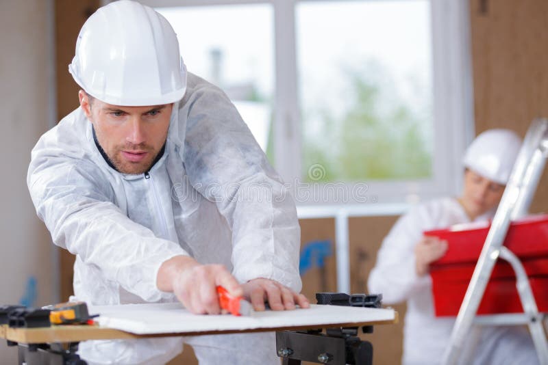 Handyman Using Cutter at Building Site Stock Image - Image of asia ...
