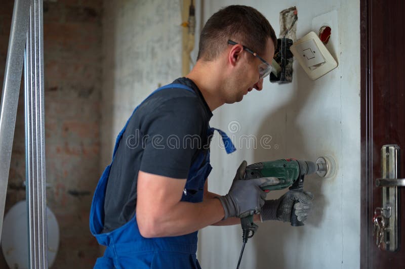 Handyman Using Drill Machine Stock Photo - Image of handyman, dust ...