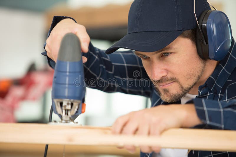 Handyman Using Electric Hacksaw Stock Image - Image of refinish ...