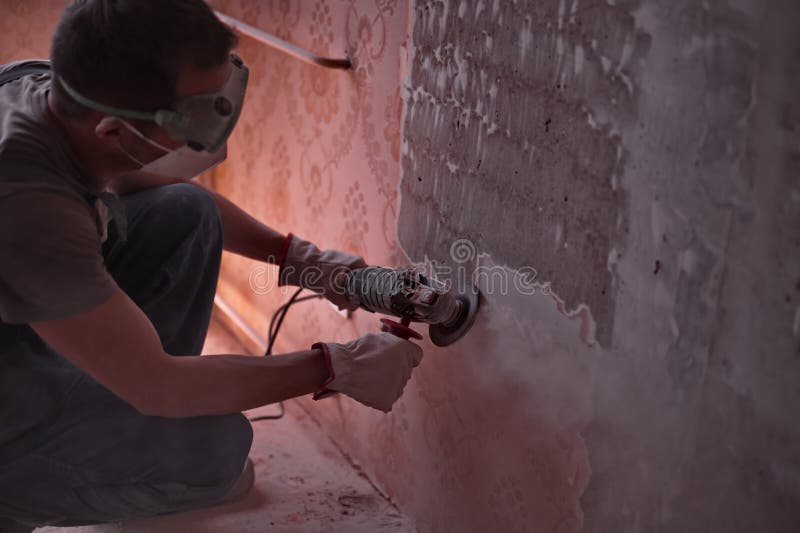 Handyman Using a Grinder To Remove Wallpaper Stock Photo - Image of ...