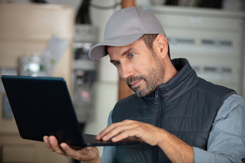 Handyman Using Portable Computer Stock Image - Image of internet ...