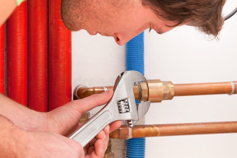 Plumber with wrench stock image. Image of sink, foreman - 110513003