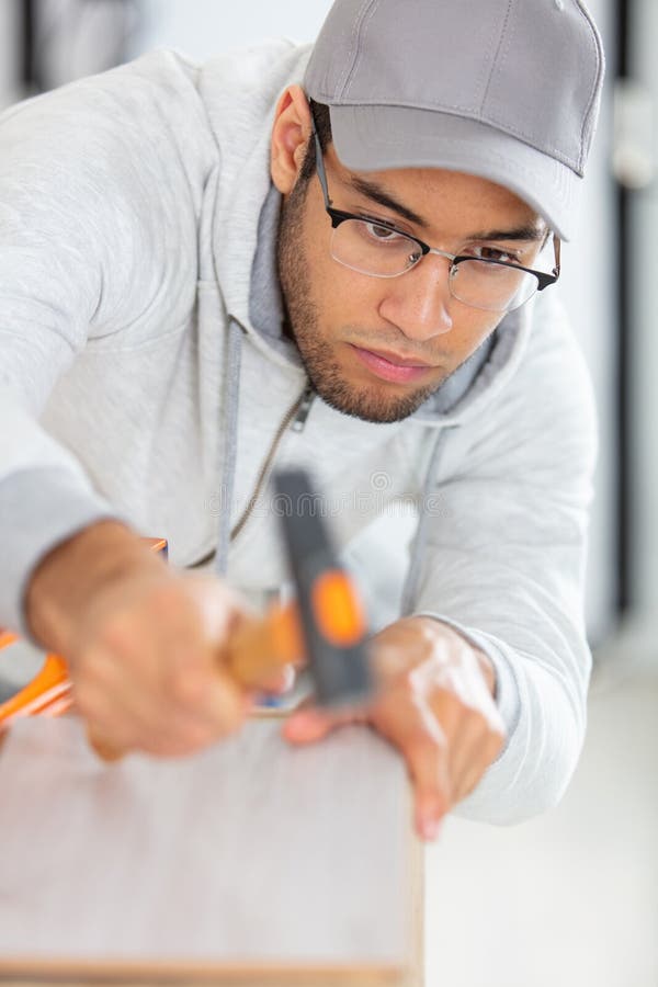 Handyman Working with Hammer on Plank Stock Image - Image of machine ...