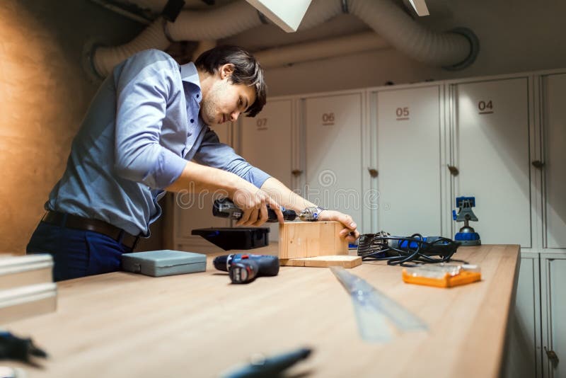 Handyman working with wood stock image. Image of skill - 125502201