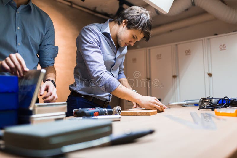 Handyman working with wood stock photo. Image of contractor - 99096528