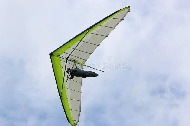 Hang Glider Flying in a Cloudy Skyt Stock Photo - Image of flying ...