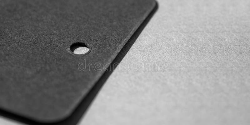 Hang Tag Mock-up for Branding Label on Grey Table. Standing Black and ...